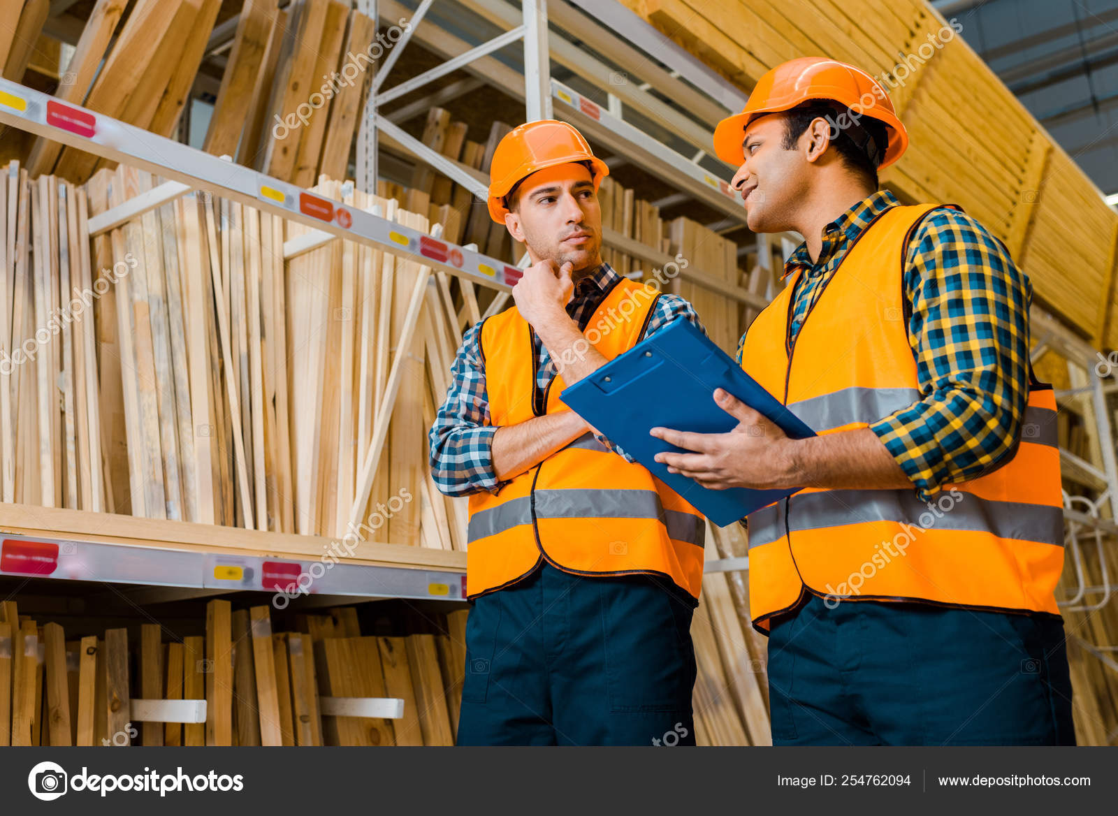 Thoughtful Multicultural Workers Standing Shelves Wooden Construction ...