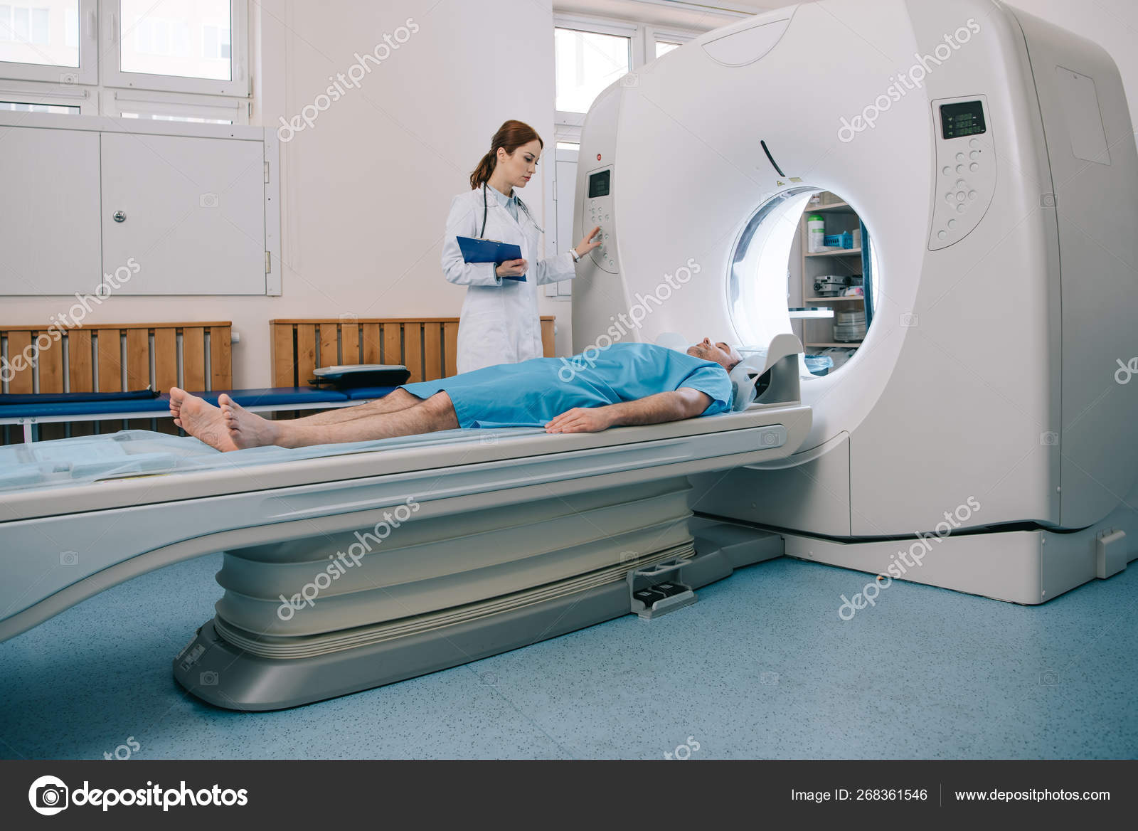 Young Radiographer Operating Scanner While Preparing Patient Tomography ...