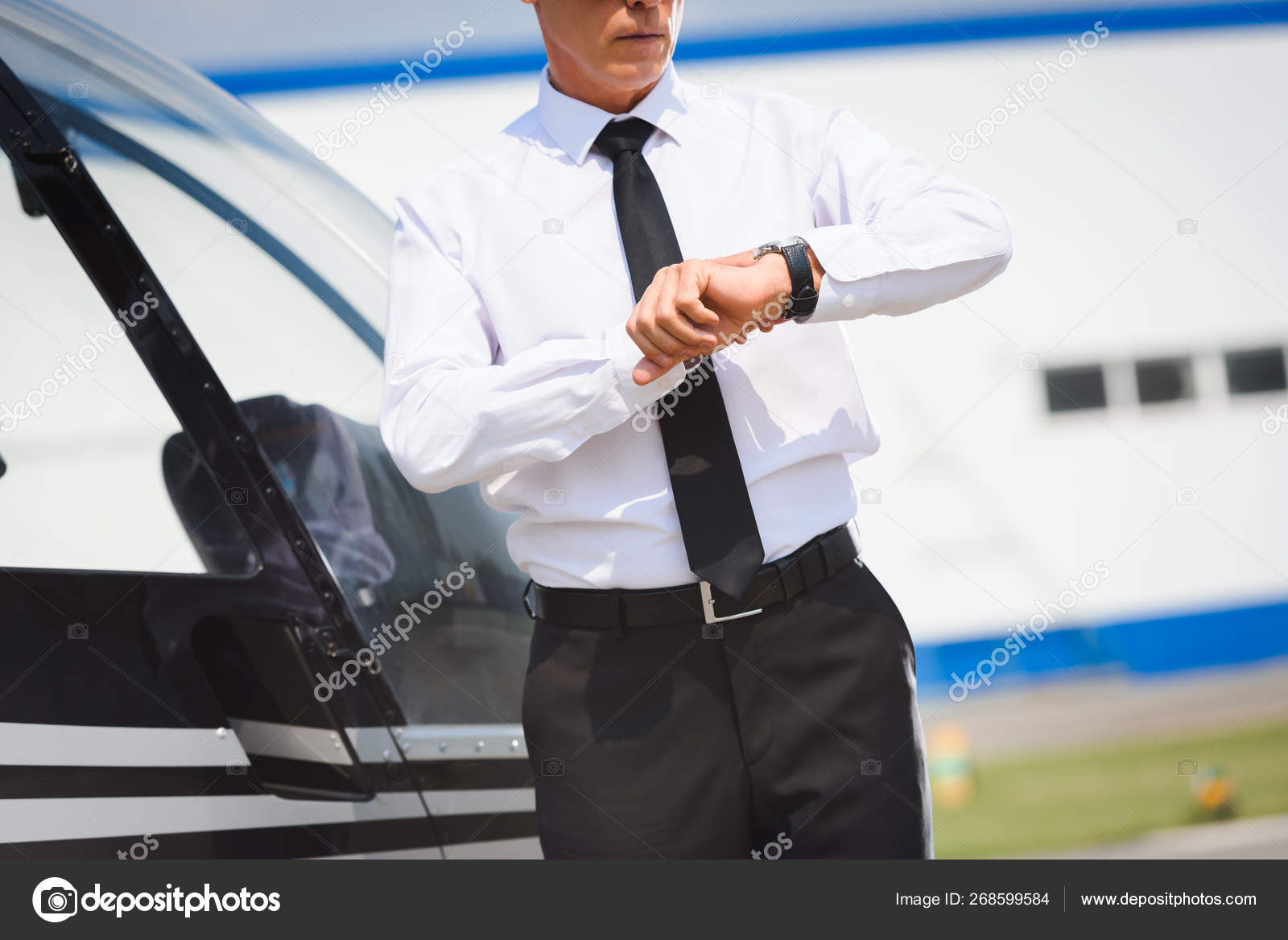 Cropped View Pilot Formal Wear Adjusting Watch Helicopter Stock Photo ...