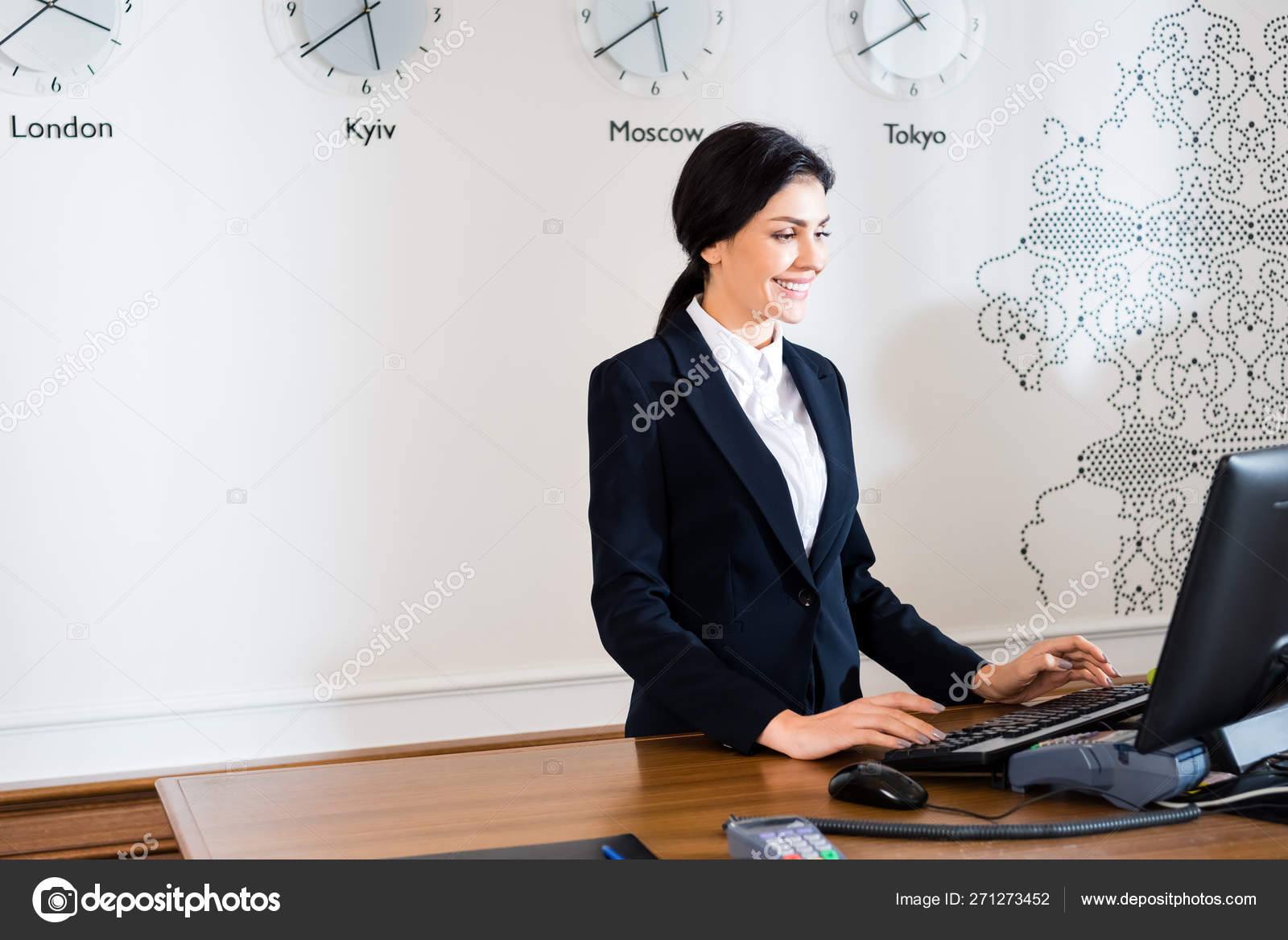 Happy Brunette Receptionist Formal Wear Standing Computer Monitor Hotel ...