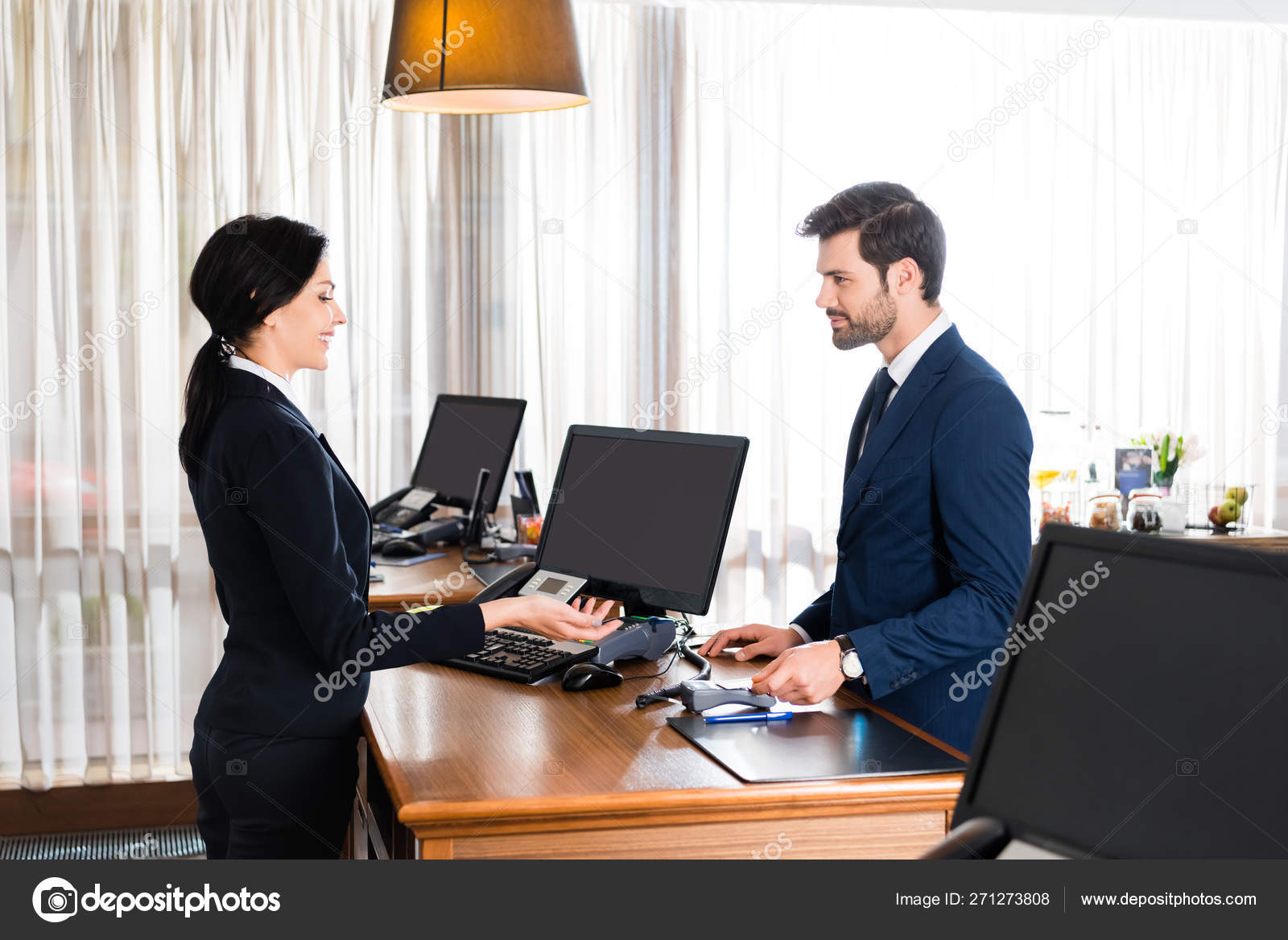 Happy Receptionist Gesturing Handsome Man Credit Card — Stock Photo ...