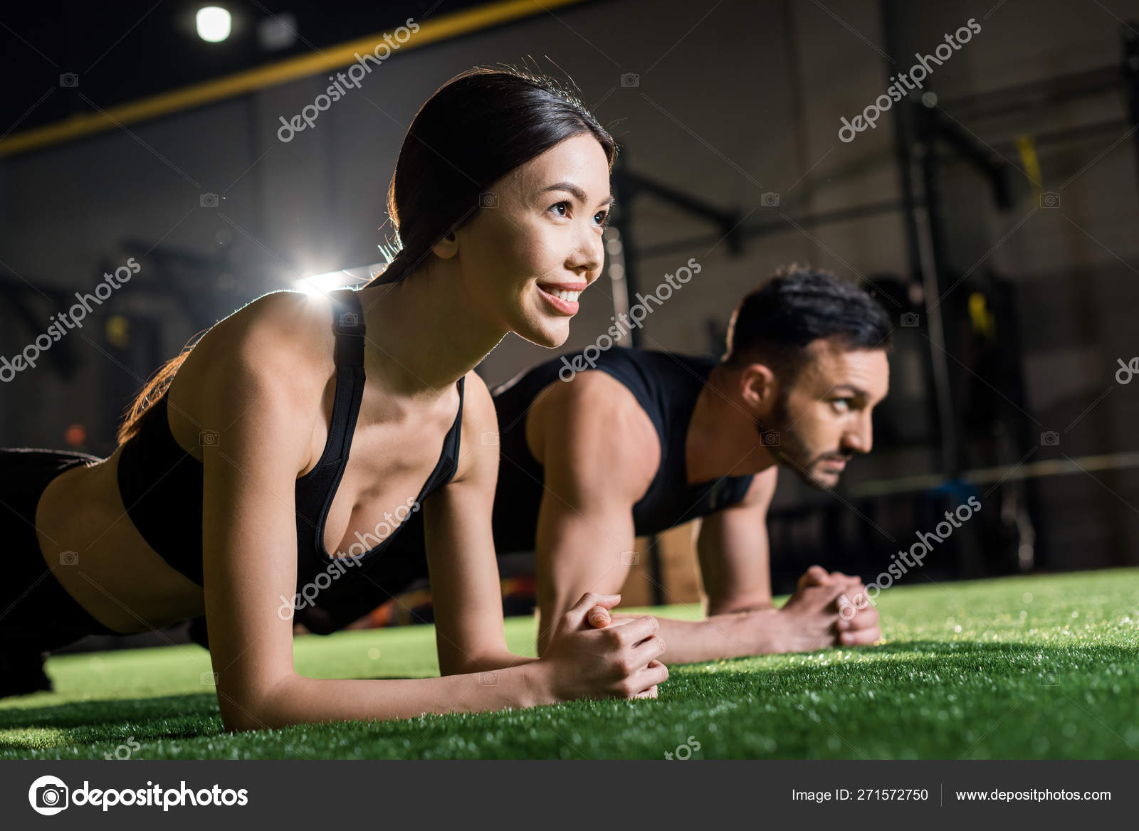 Selective Focus Cheerful Woman Smiling While Doing Plank Exercise Man
