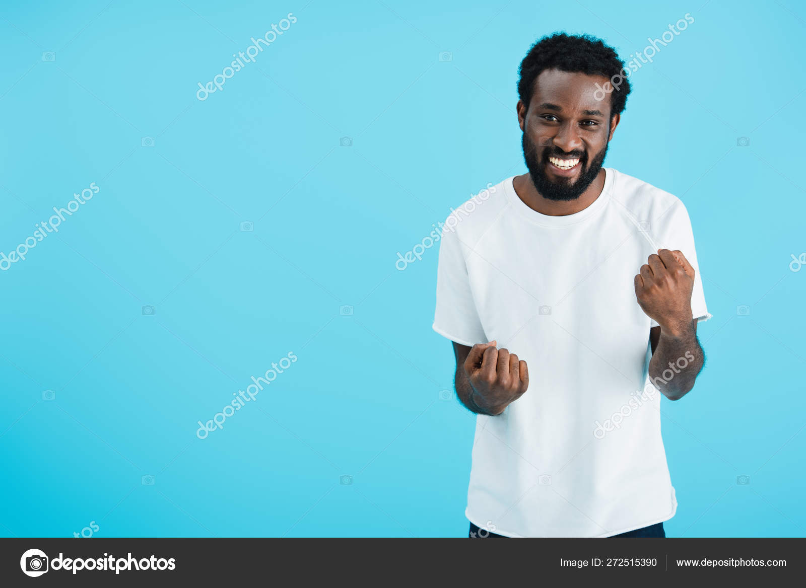 Successful African American Man Celebrating Triumph Isolated Blue Stock ...