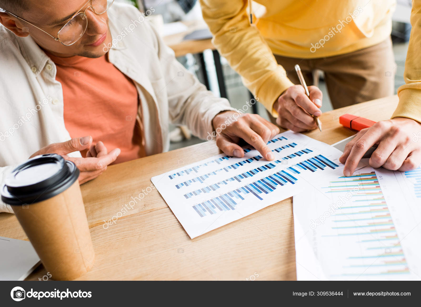 Young Businesspeople Analyzing Graphs Charts Workplace Office Stock ...
