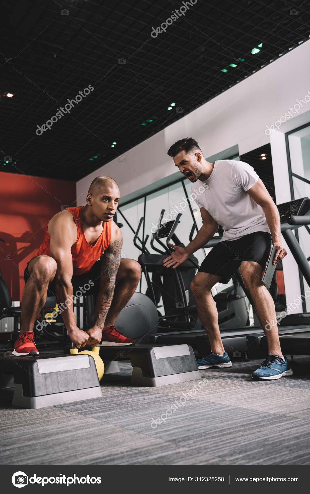 Excited Trainer Shouting While Motivating African American Sportsman ...