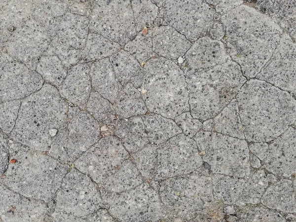 Texture of cracked asphalt. Texture of old gray cracked rough asphalt ...