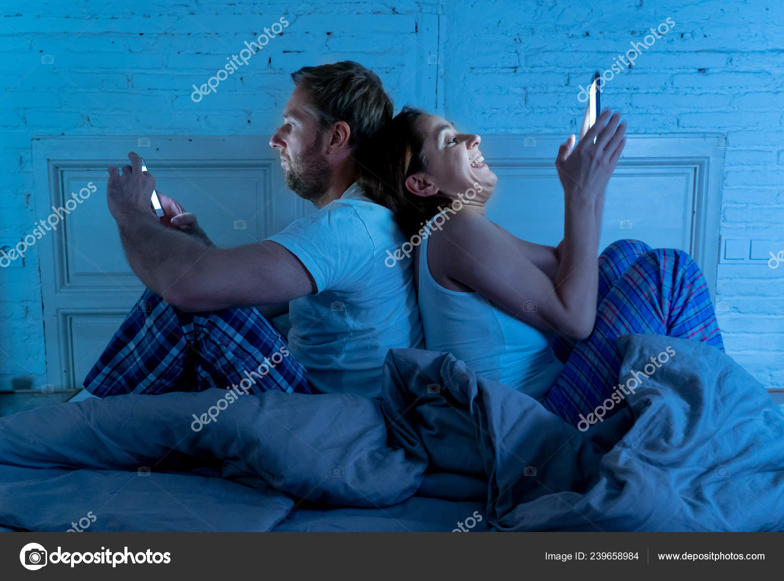 Couple Bed Using Phones Husband Frustrated Upset Unsatisfied While