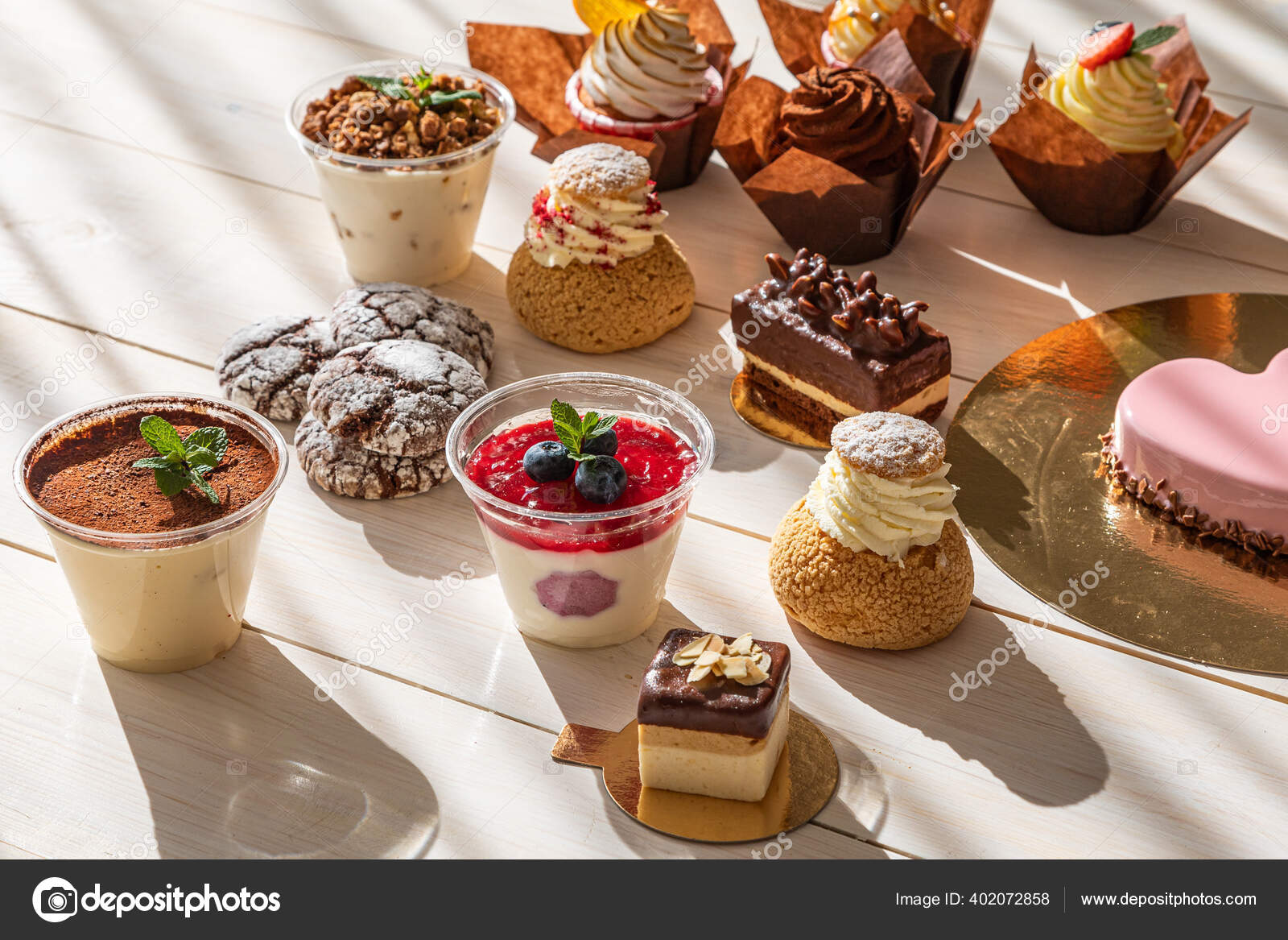 Assorted desserts on a white board in natural light — Stock Photo © jm ...
