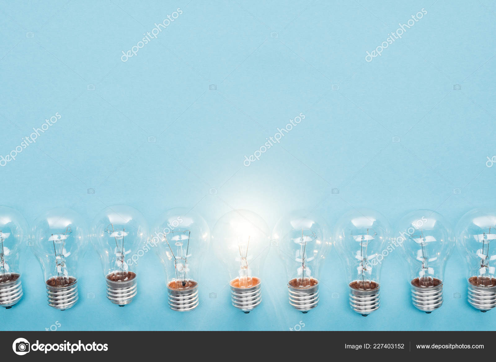 Top View Light Bulbs Row One Them Glowing Blue Background — Stock Photo ...