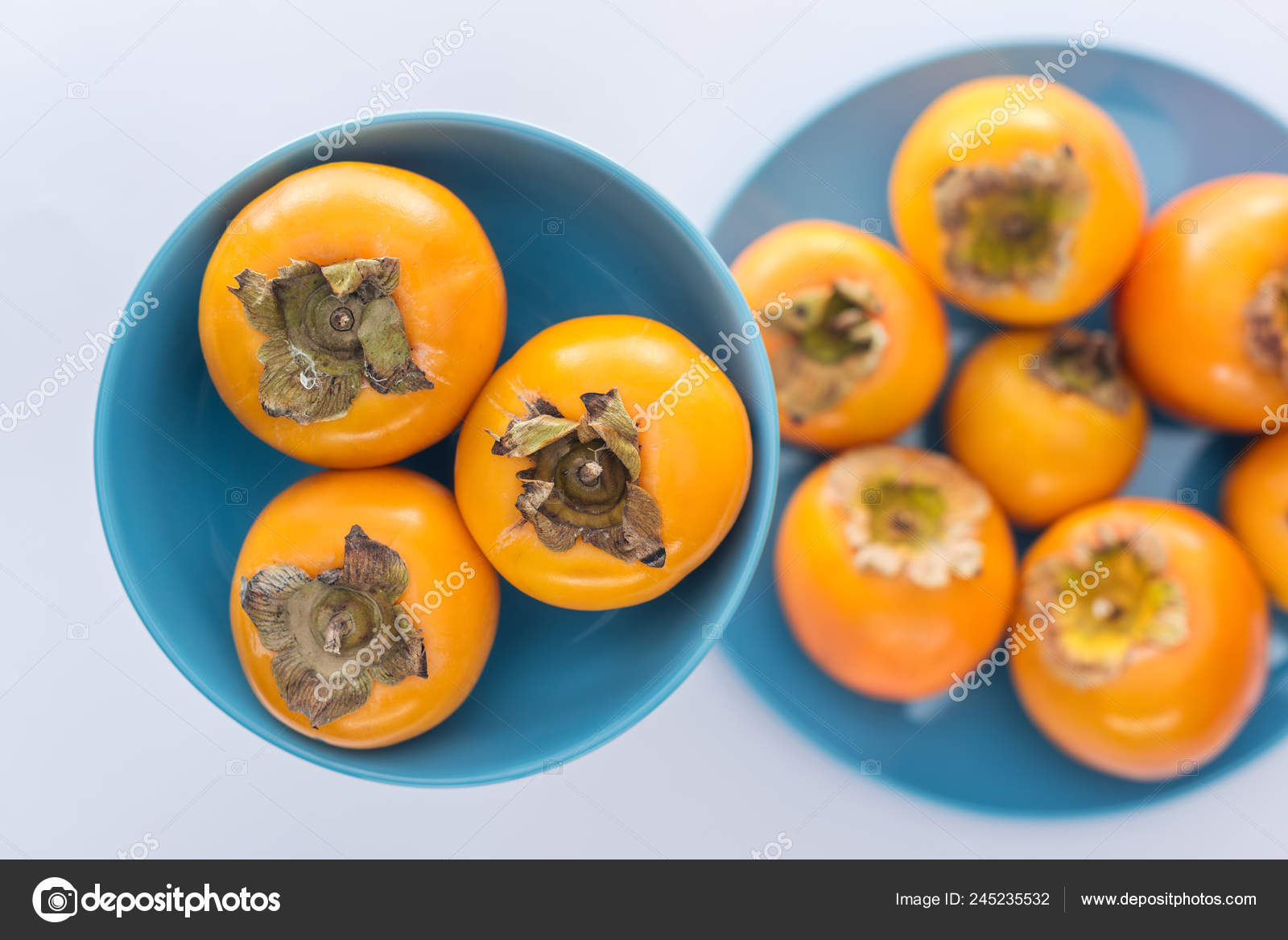 Selective Focus Whole Sweet Persimmons Blue Glass Plates Stock Photo by ...