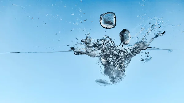 Transparent Water Falling Ice Cubes Splash Blue Background Stock Photo ...