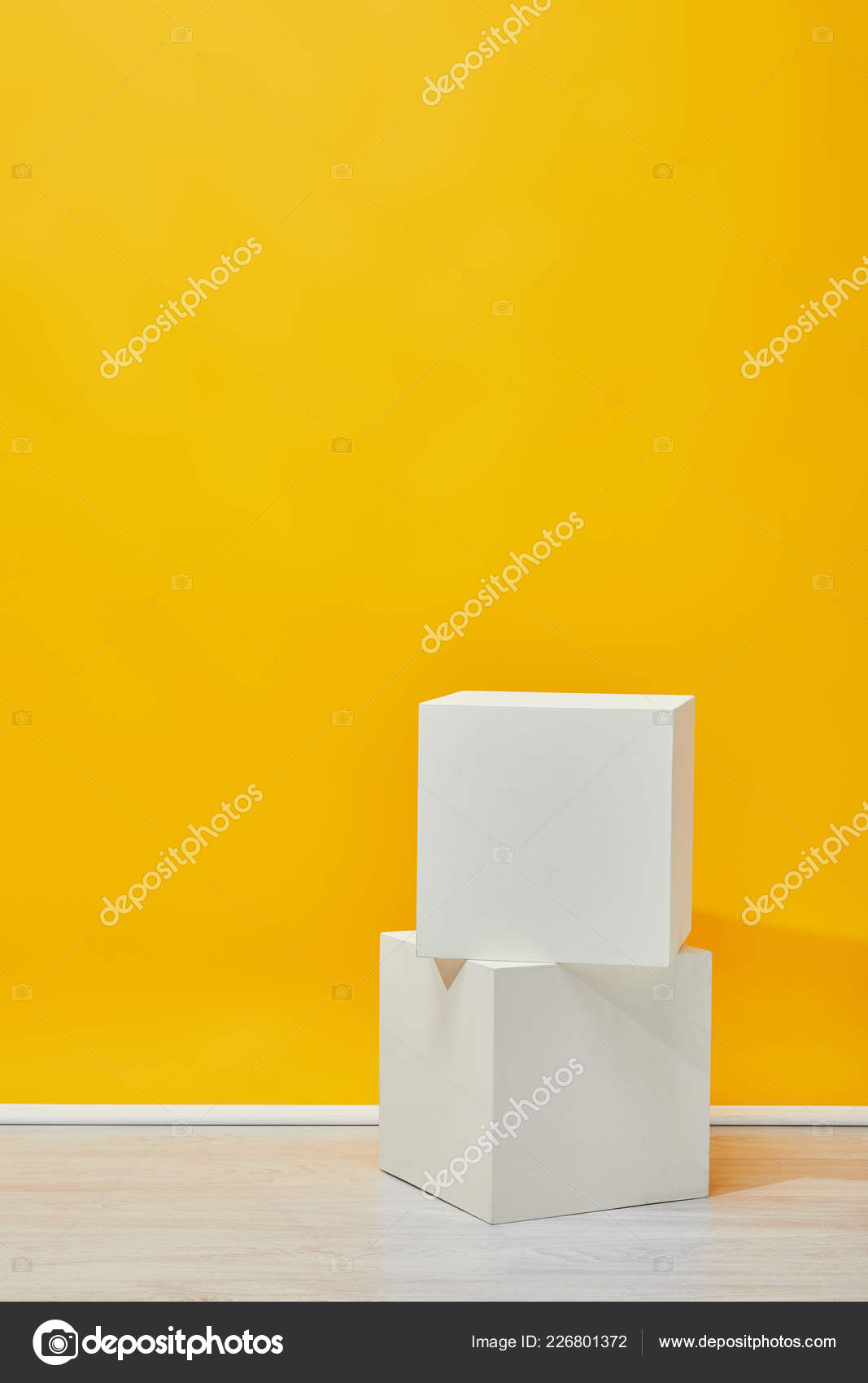 Two Plaster Cubes Arranged Vertically Yellow Wall Stock Photo by ...