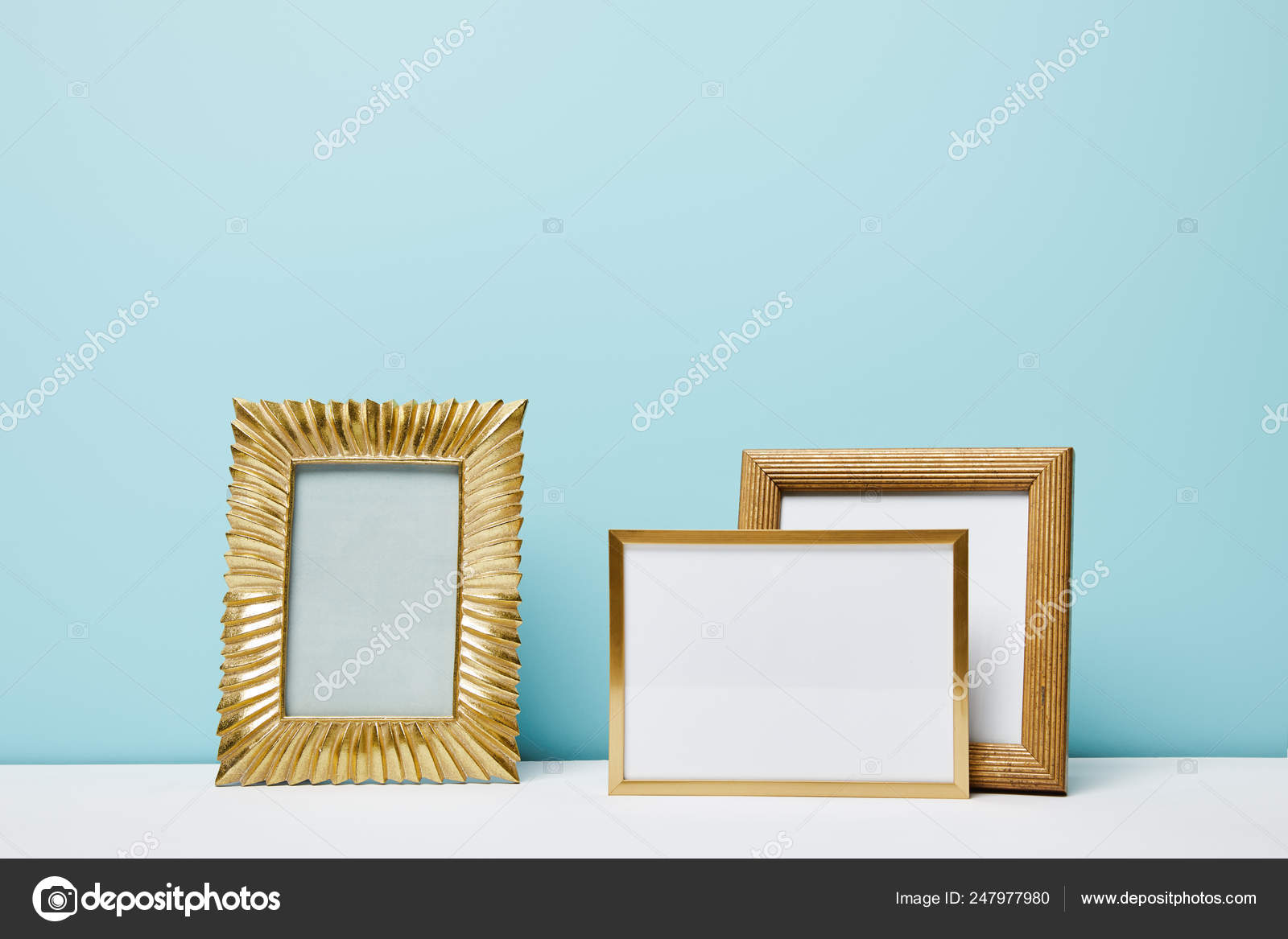 Blank Decorative Frames Blue Wall — Stock Photo © AntonMatyukha #247977980
