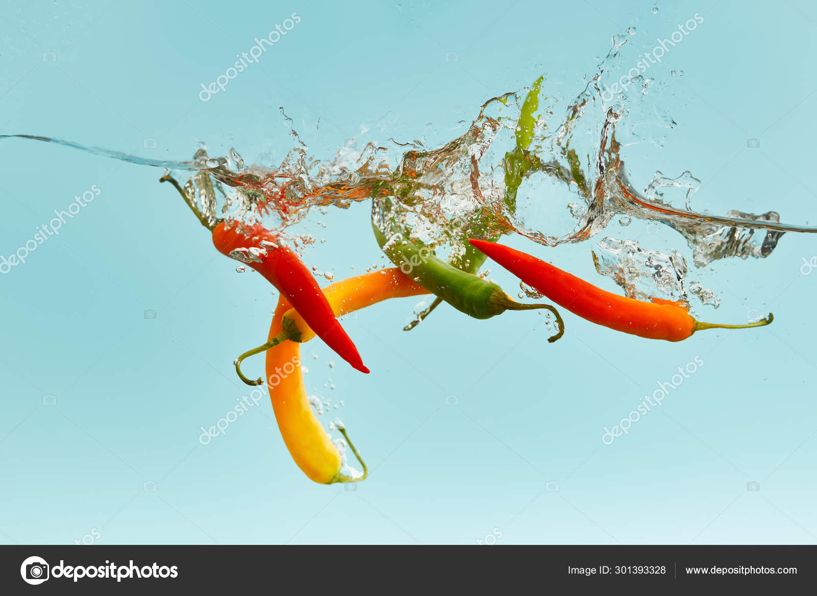 Multicolored Chili Peppers Falling Deep Water Splash Blue Background ...
