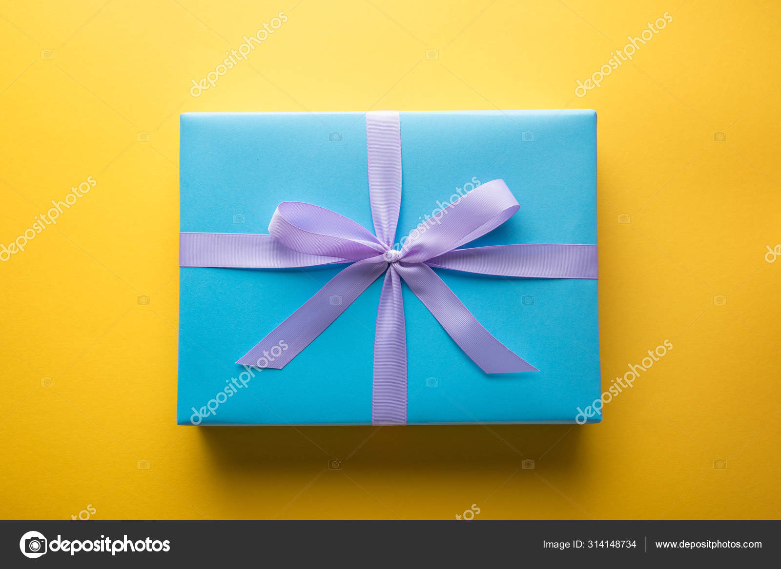 Top View Blue Gift Box Violet Ribbon Yellow Background Stock Photo by ...