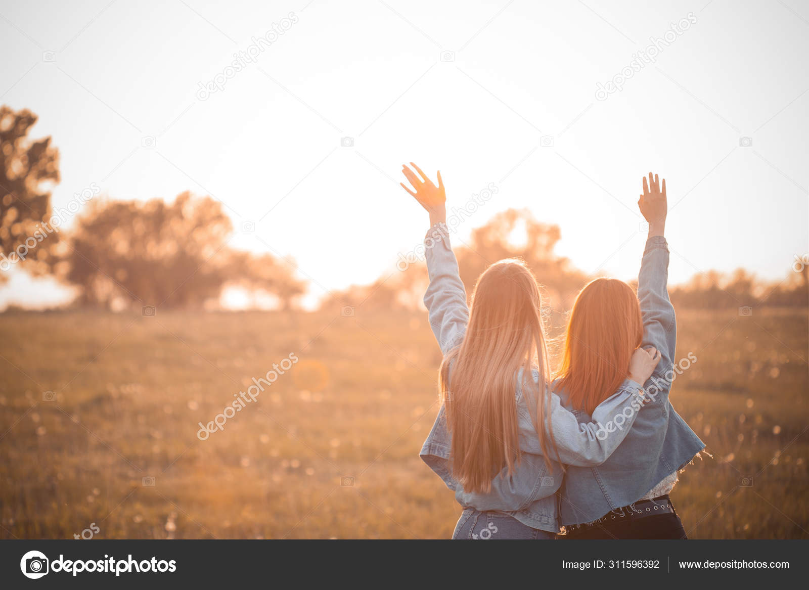 Two Best Friends Holding Hands In The Sunset