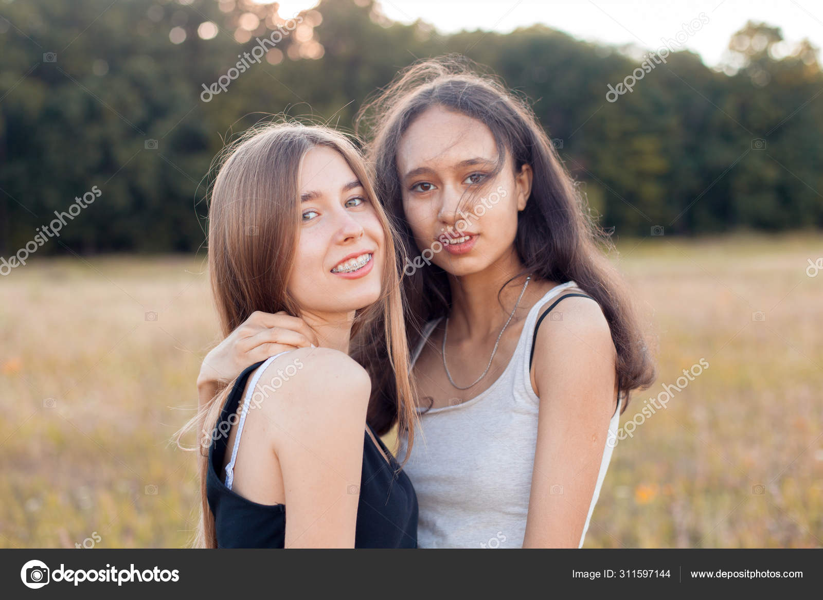 Two Attractive Young Women Hugging Outdoors Best Friends Stock Photo by ...