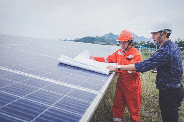engineer in solar power plant working on installing solar panel - Stock ...