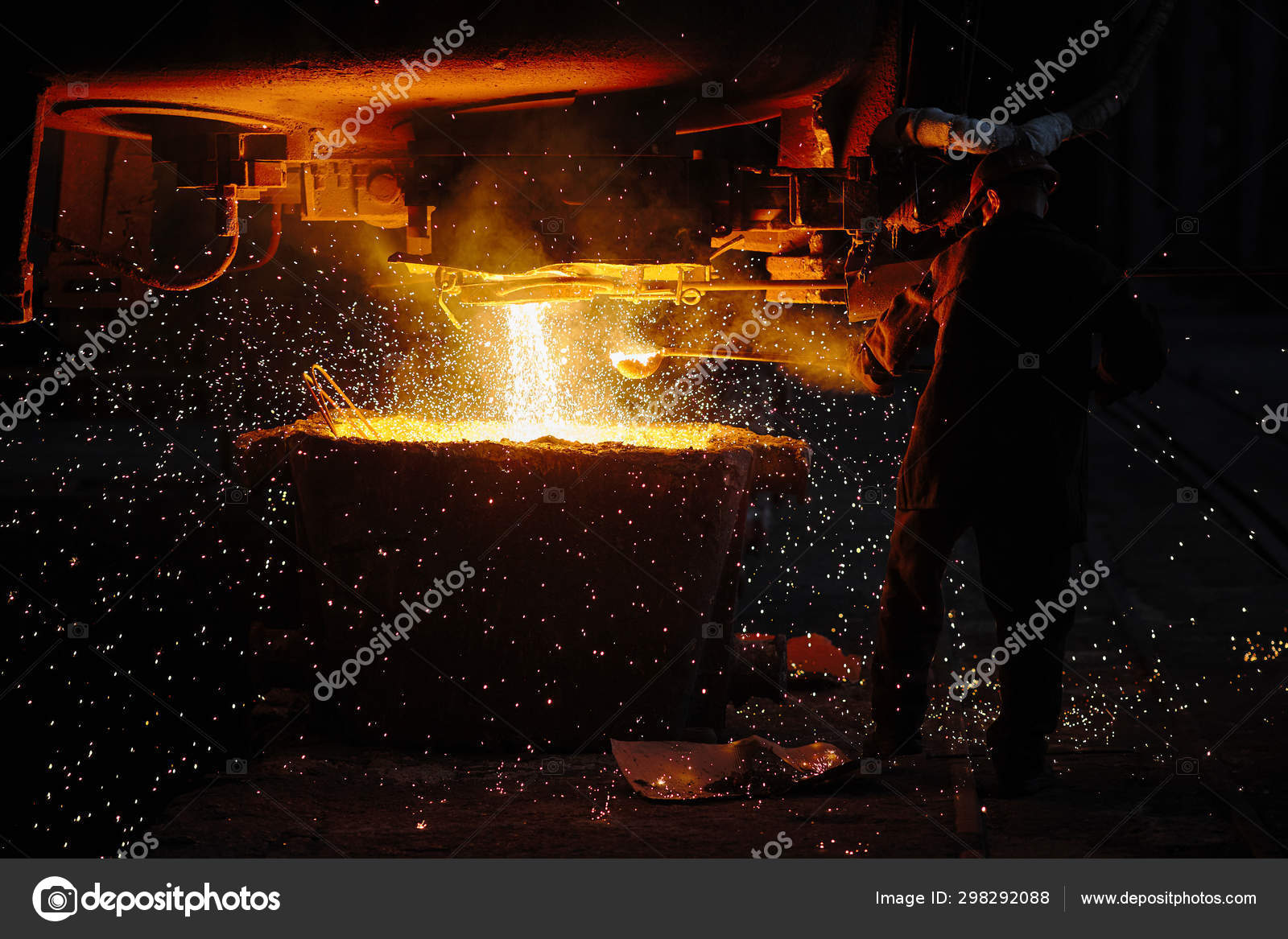 Steelmaker at ingot casting. Electric arc furnace shop EAF. Metallurgy ...