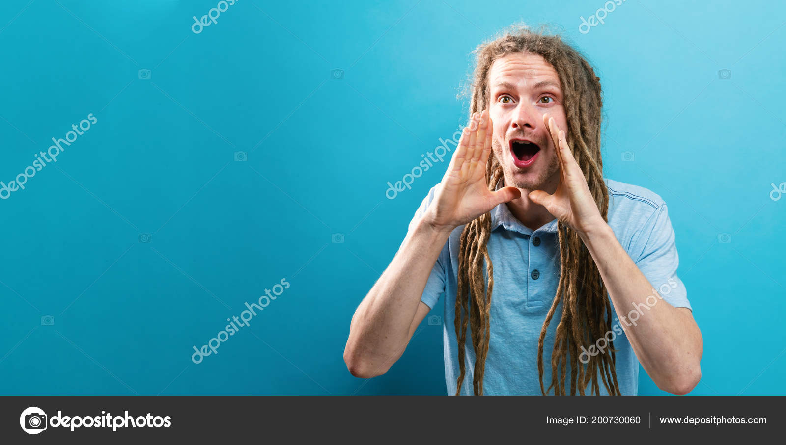 Young man shouting on a solid background Stock Photo by ©Melpomene ...