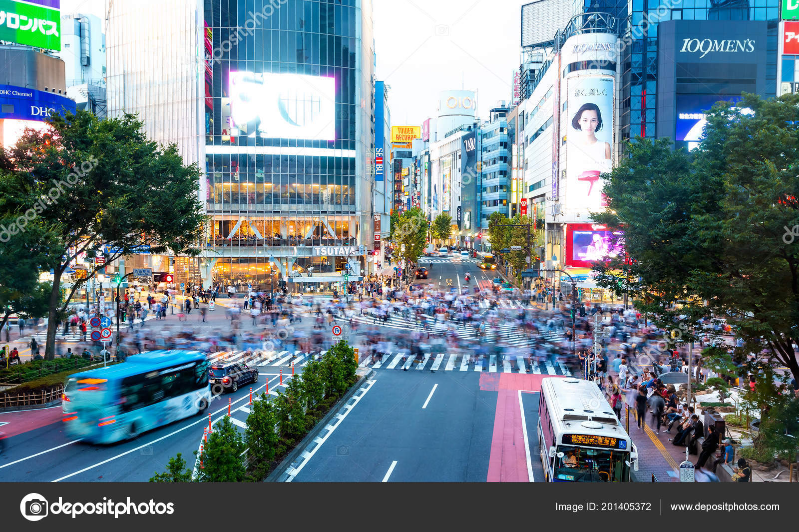 People cross the famous intersection in Shibuya, Tokyo, Japan one of ...