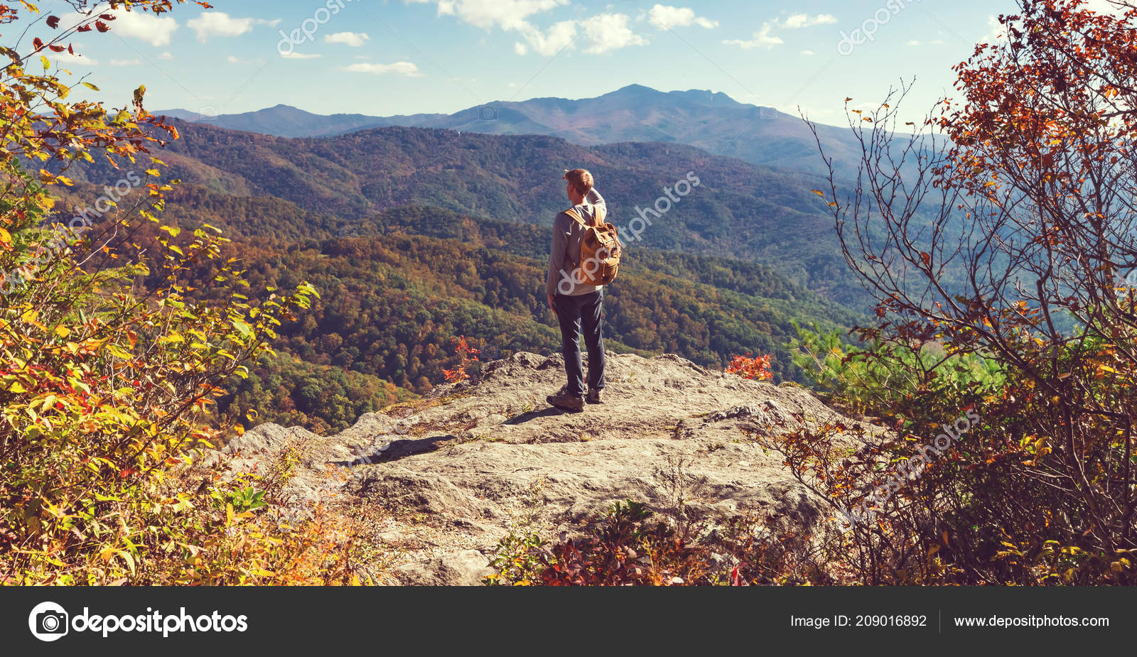 Man walking on the edge of a cliff Stock Photo by ©Melpomene 209016892