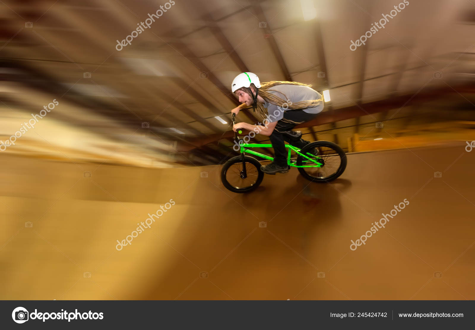 Man riding on a BMX bicycle at an extreme sports park — Stock Photo ...