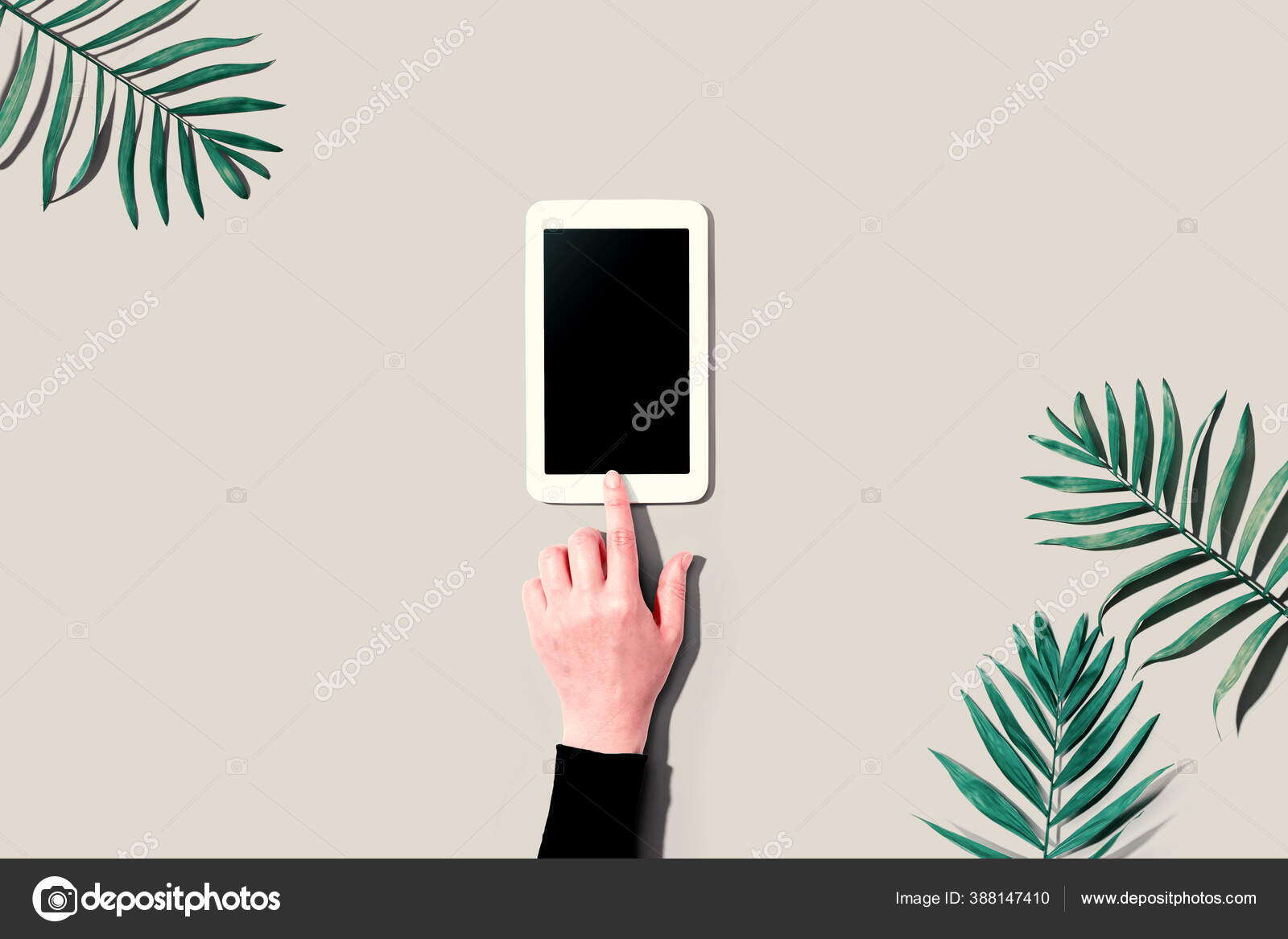 Person using a tablet computer with tropical leaves — Stock Photo ...