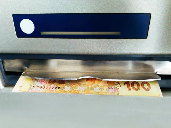 cash withdrawal from ATM. banknotes in ATM. banknotes dispensed from an ...
