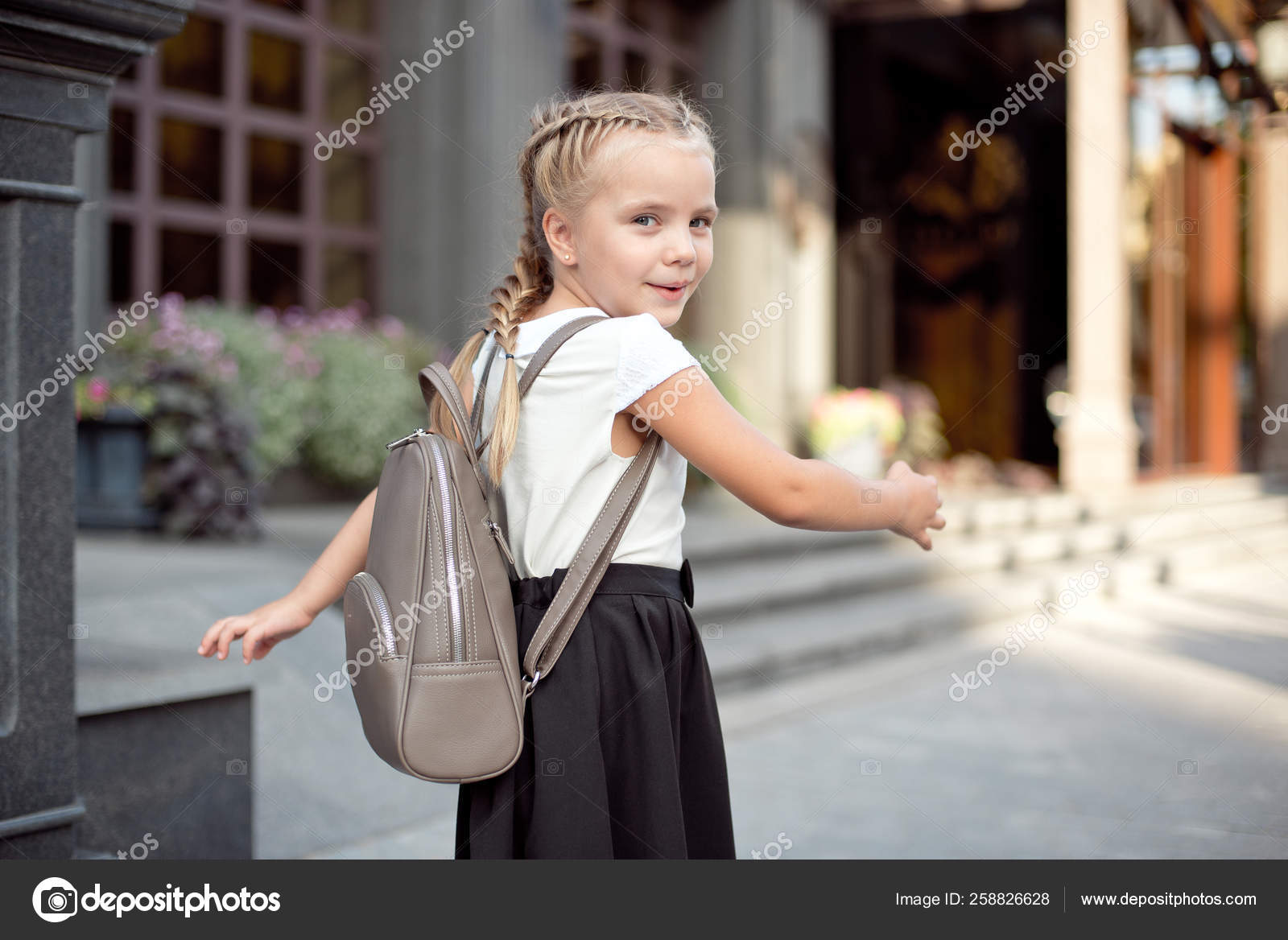 Happy smiling girl is going to school for the first time with bag go to ...