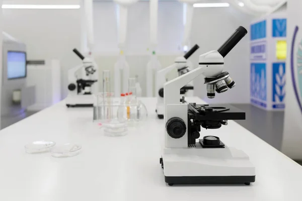 Microscope and test tubes in laboratory Stock Photo by ©AndreyBezuglov ...