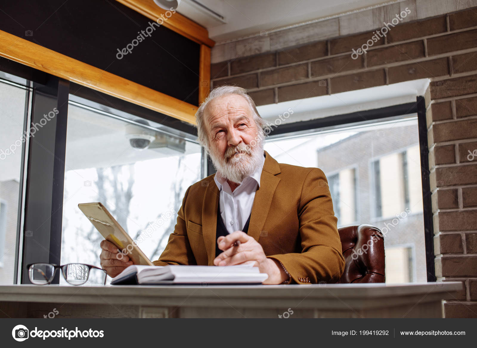 Old man with white hair, moustache and beard is learning computer ...