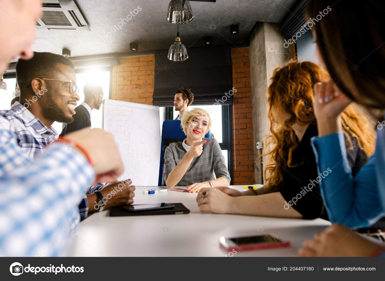 Good-looking boss with beautiful makeup is pointing to her worker ...