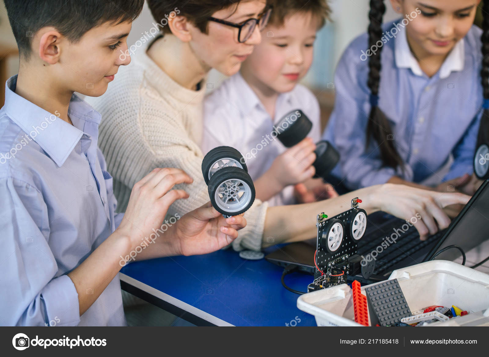 Happy children learn programming using laptops on extracurricular ...