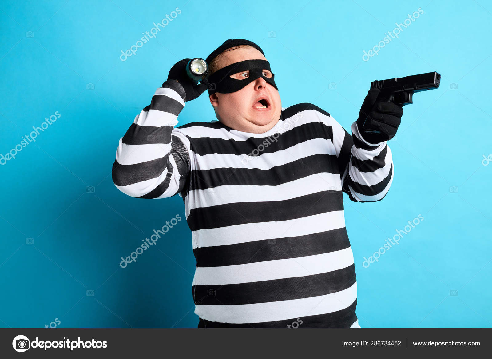 Fat burglar being scared by policeman Stock Photo by ©ufabizphoto 286734452