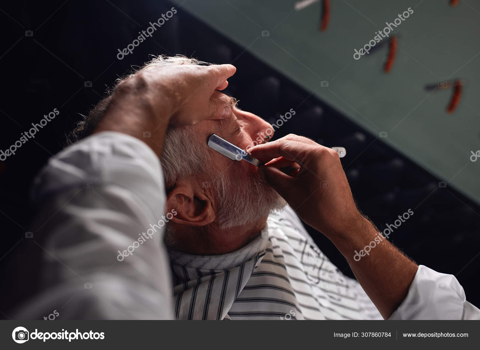 Barber using straight razor during work — Stock Photo © ufabizphoto ...