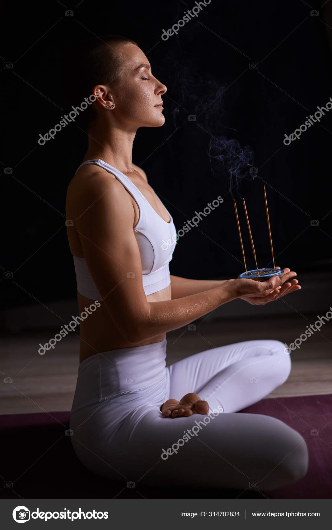 Young woman relaxing with smoking aromatic sticks. aromatherapy ...