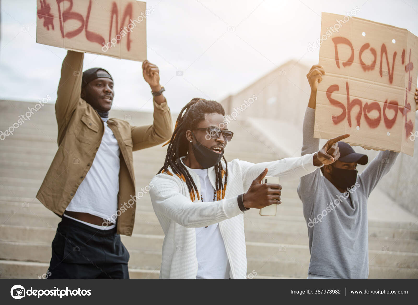 Demonstrators with banners in streets Stock Photo by ©ufabizphoto 387973982