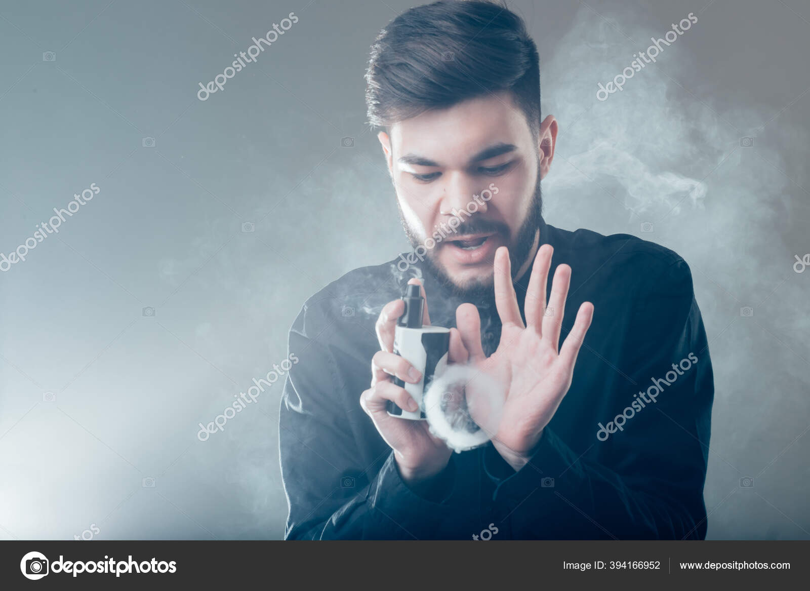 Men with beard vape and produse steam rings Stock Photo by ©ufabizphoto ...