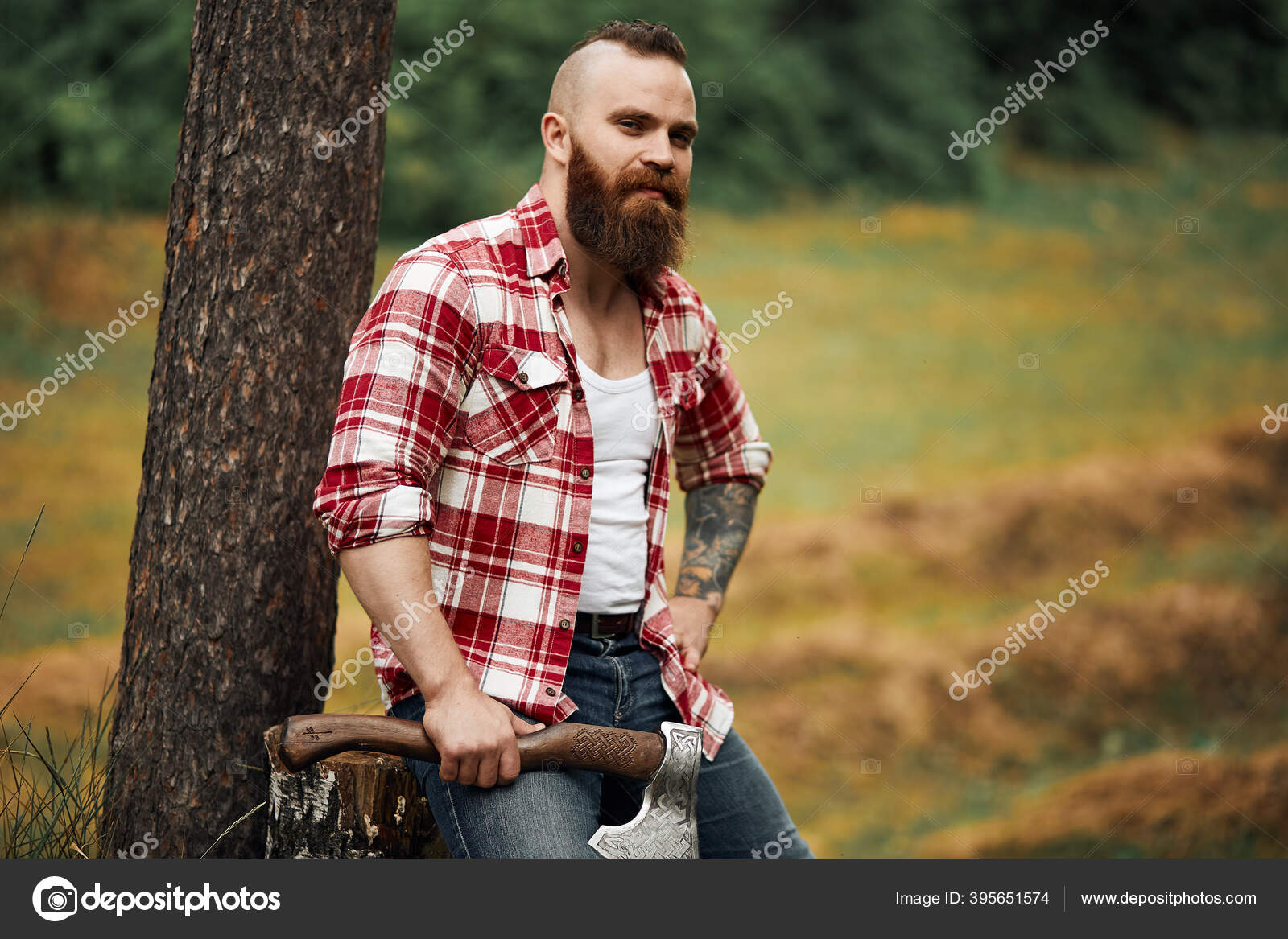 Lumberjack sitting in forest resting after hard work Stock Photo by ...