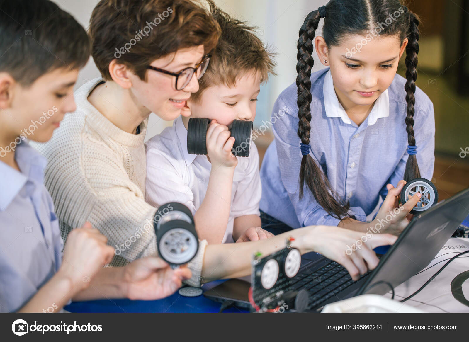 Happy children learn programming using laptops on extracurricular ... Happy children learn programming using laptops on extracurricular ...