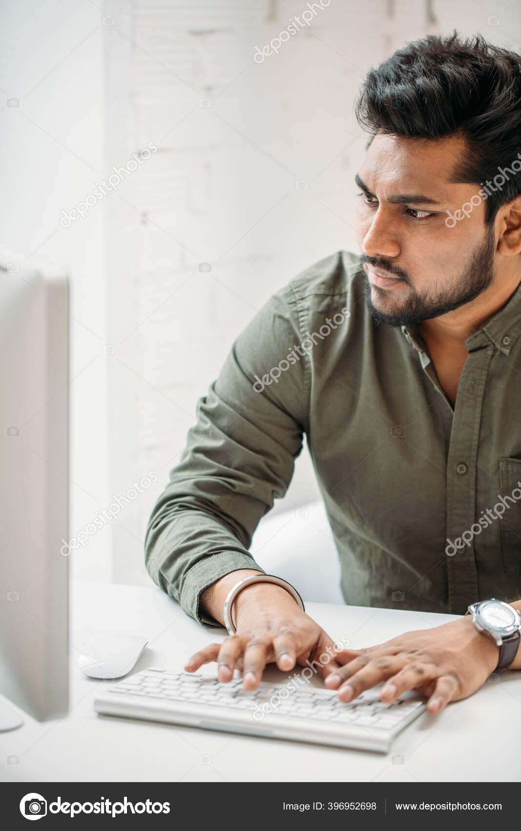Indian man working at computer from modern bright office Stock Photo by ...