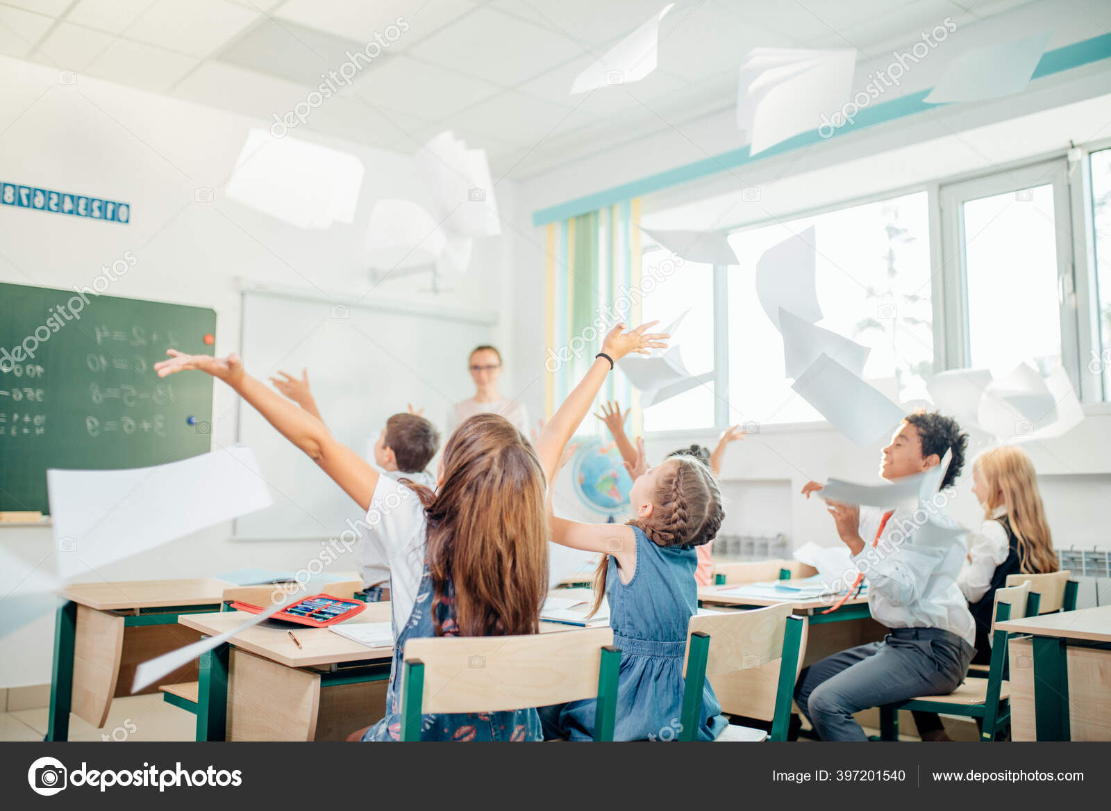 School kids have fun in class and throwing paper in air — Stock Photo ...