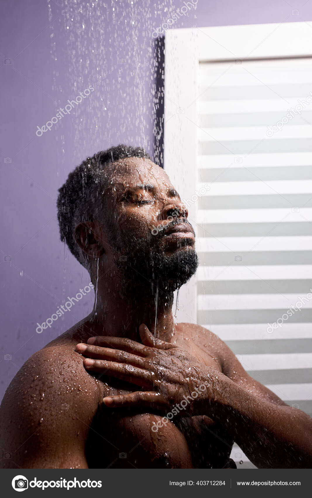 Man in shower cubicle, take shower Stock Photo by ©ufabizphoto 403712284