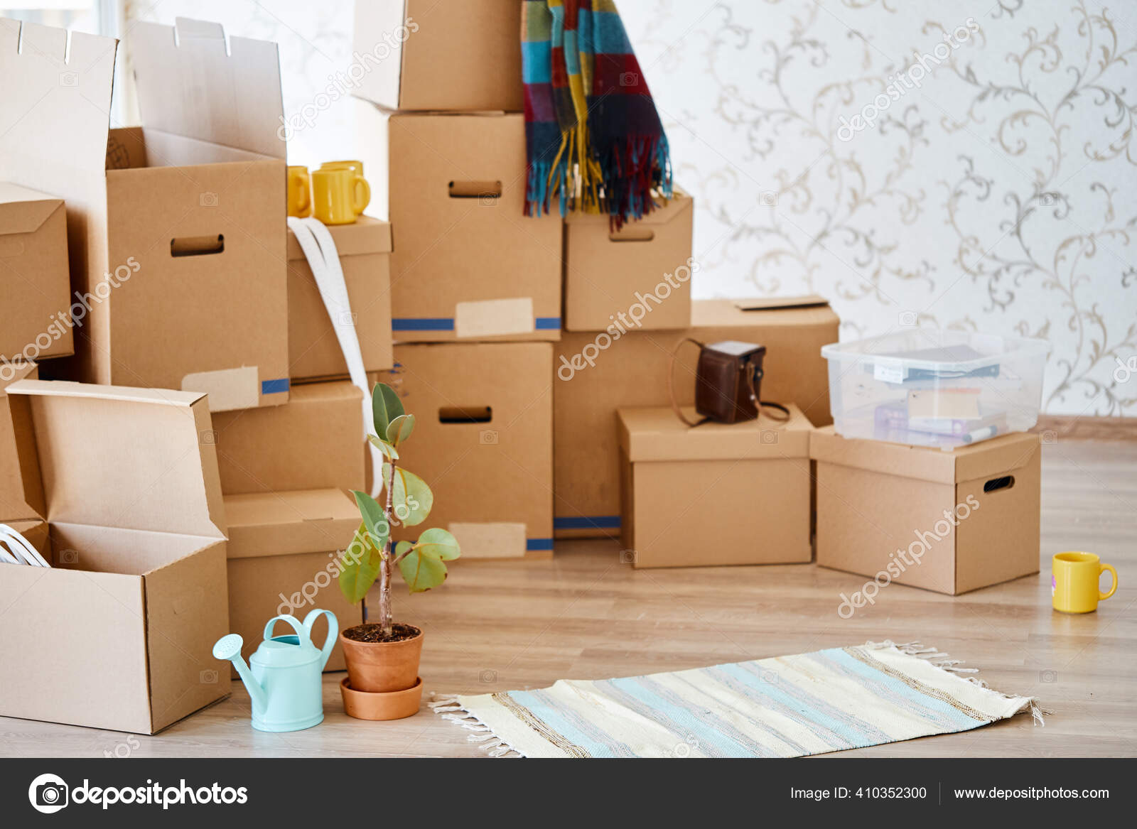 Stack of cardboard boxes in room of new home — Stock Photo ...