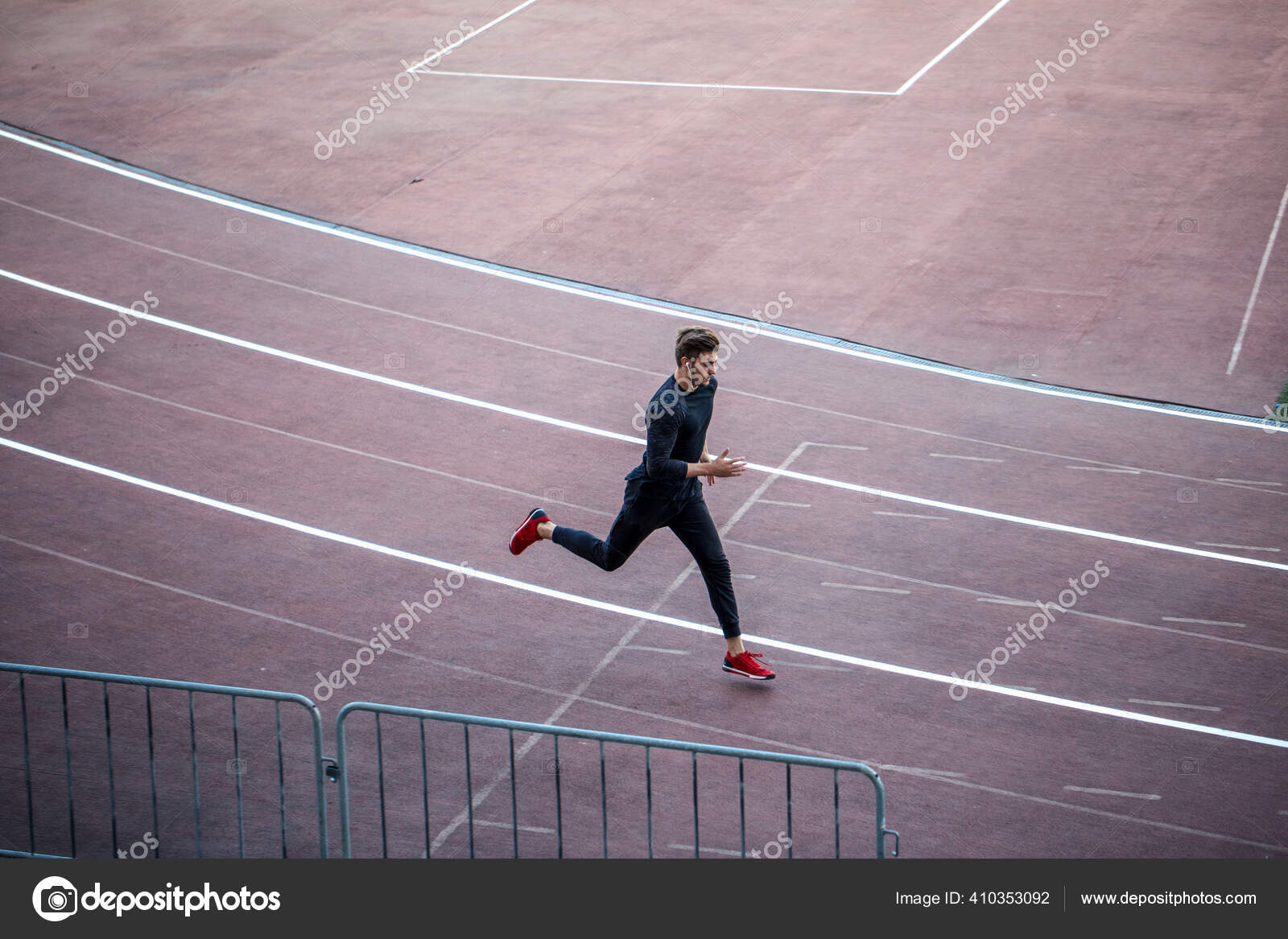 Top view Athlete running on running track. Runner sprinting on red ...