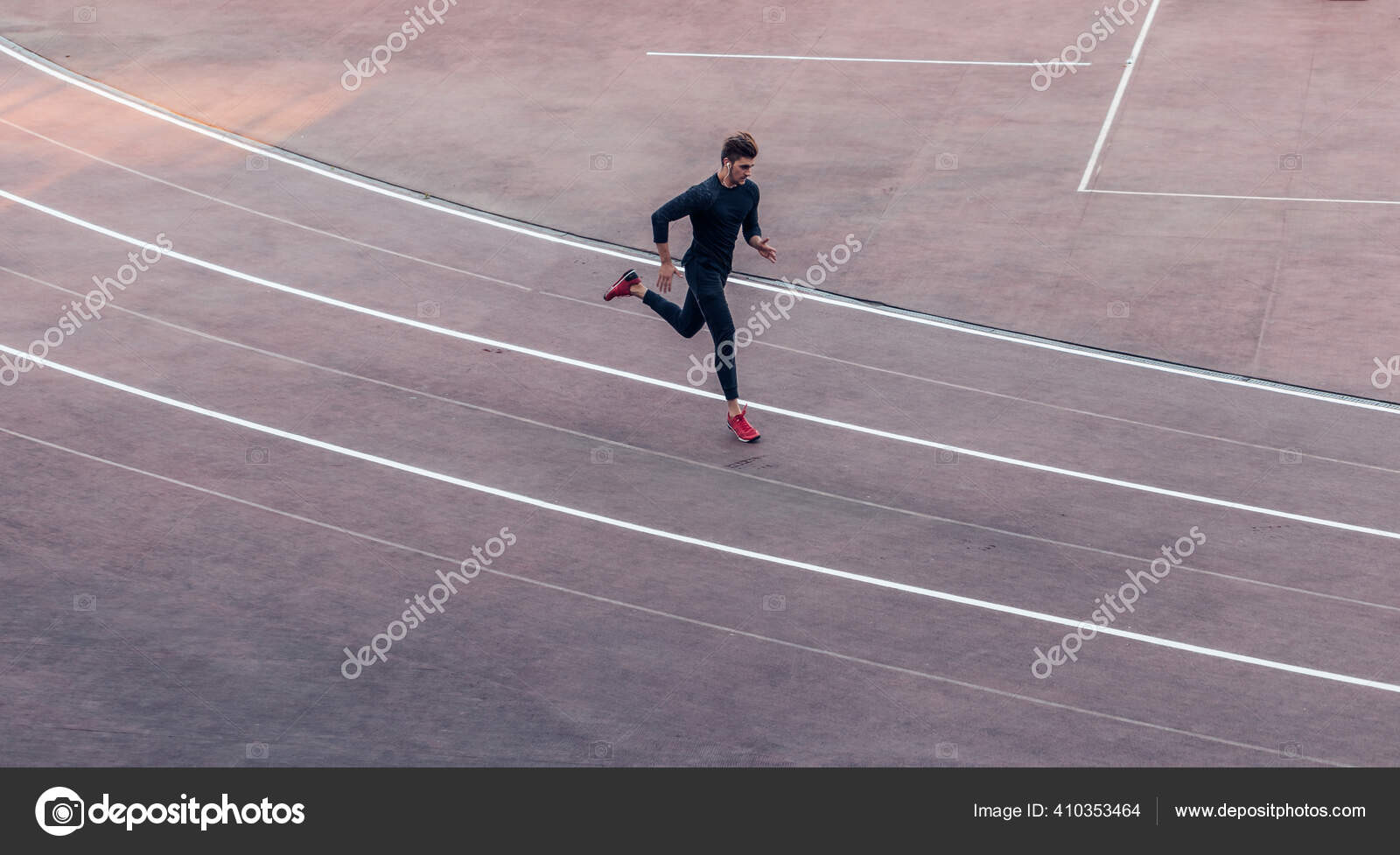 Top view Athlete running on running track. Runner sprinting on red ...