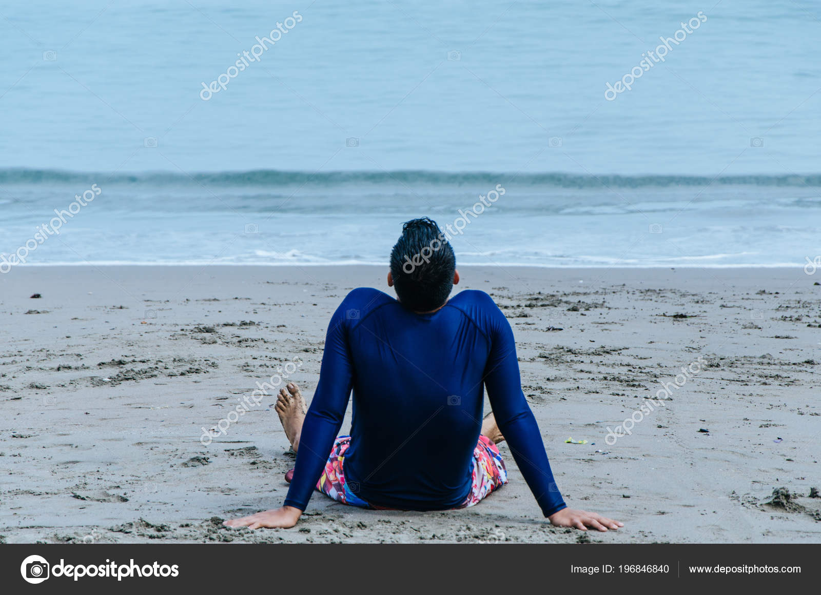 Man sitting on beach — Stock Photo © Peruphotoart #196846840