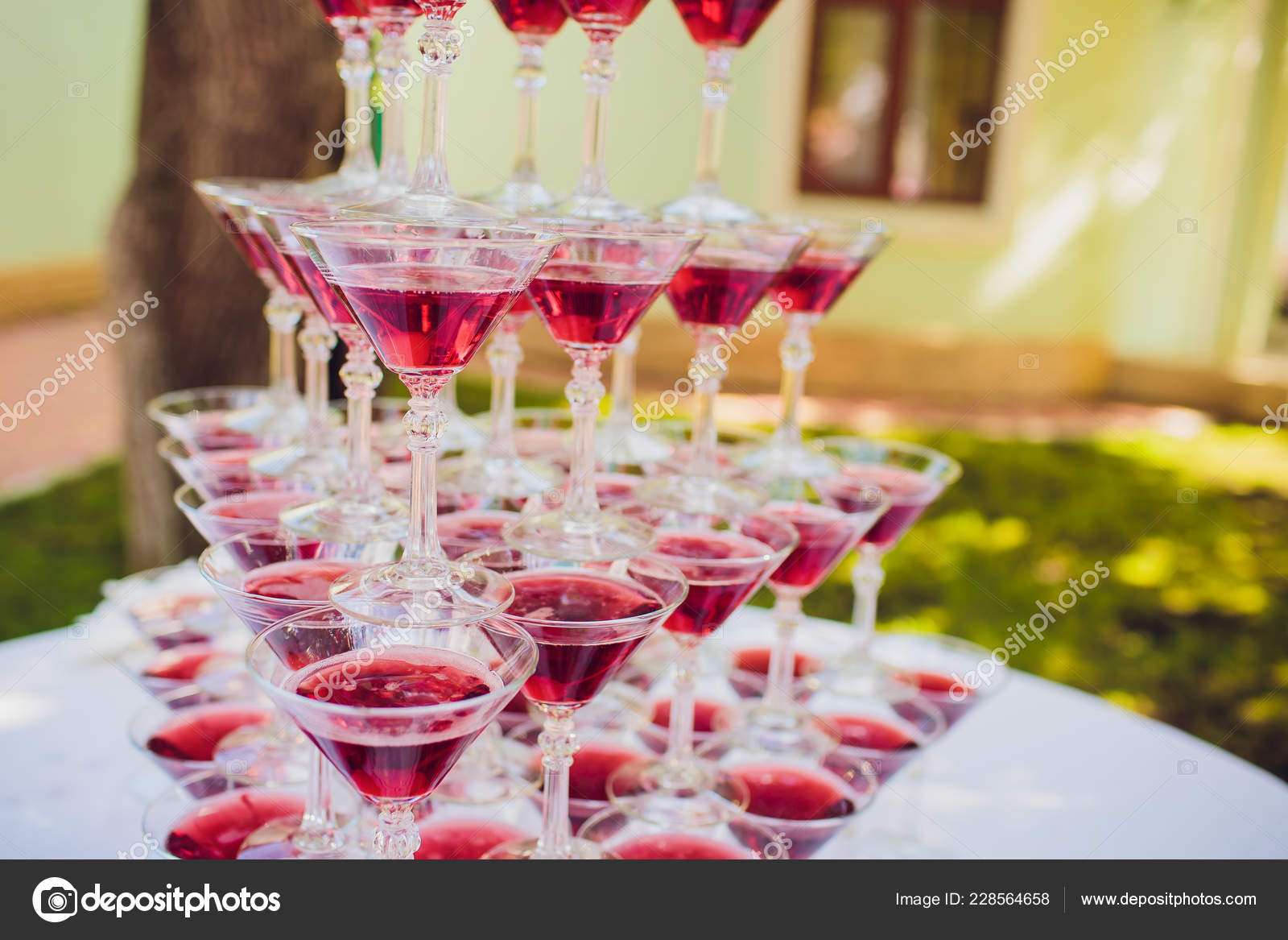 Pyramid of glasses of wine, champagne on the street. Stock Photo by ...