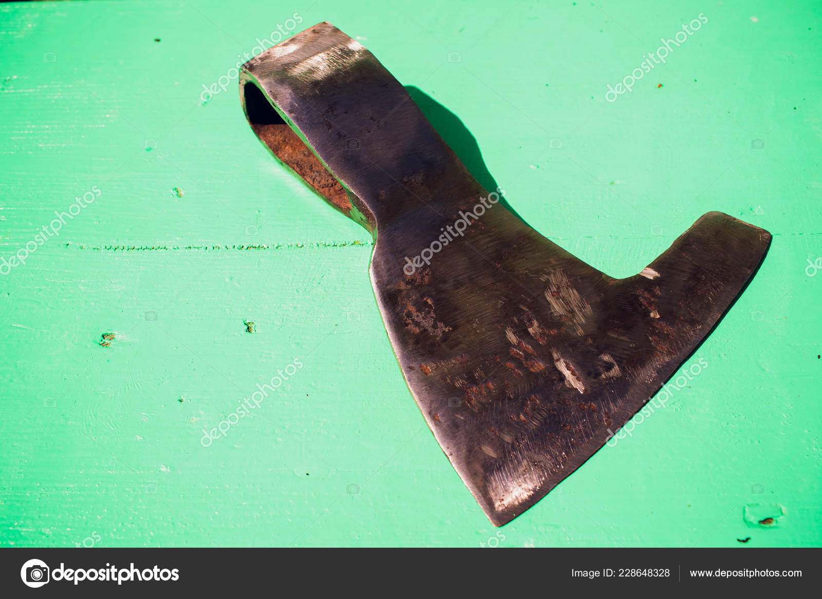 Rusty tip of sharp ax lies on edging boards Stock Photo by ©vershinin ...